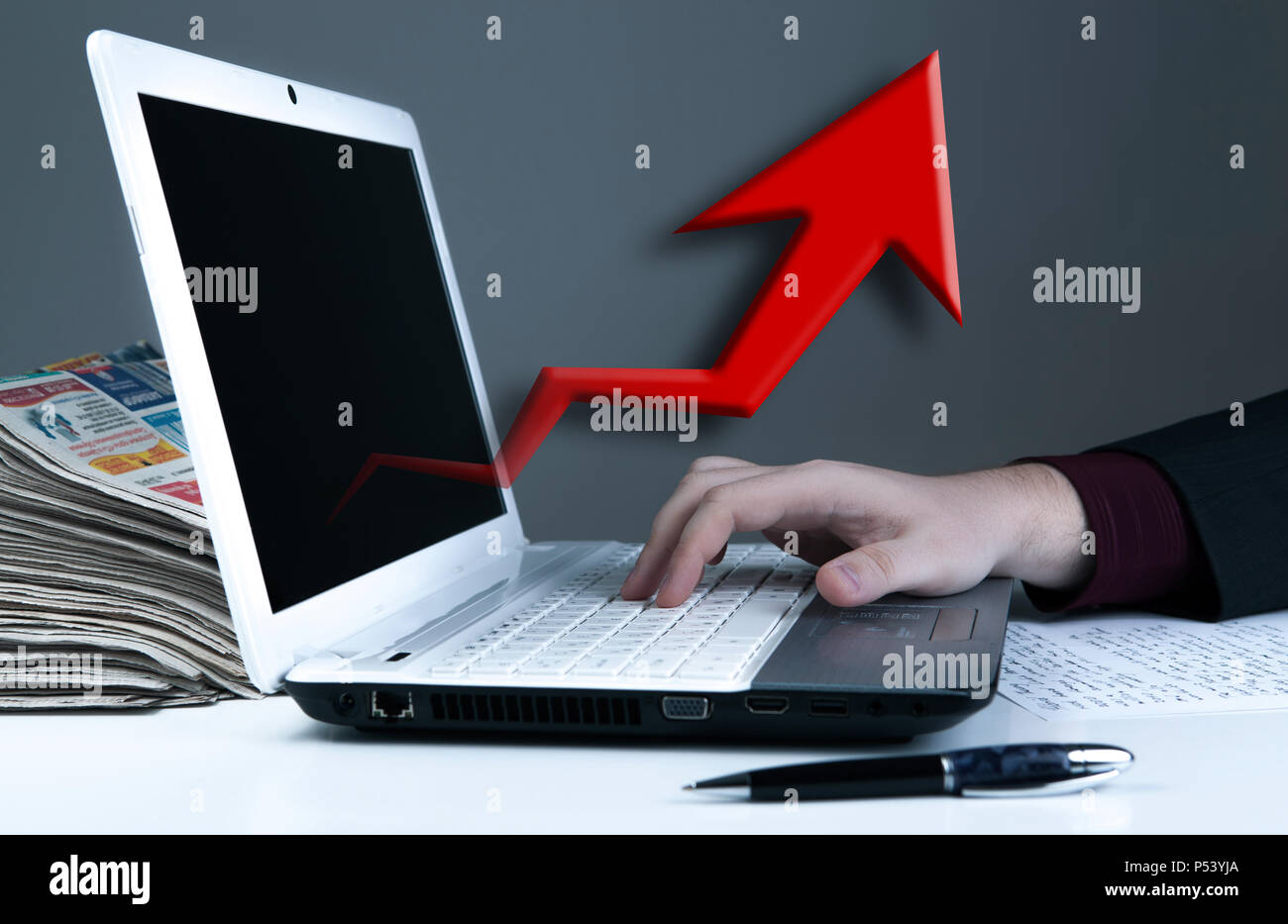 human hand on the notebook keyboard and red arrow Stock Photo - Alamy