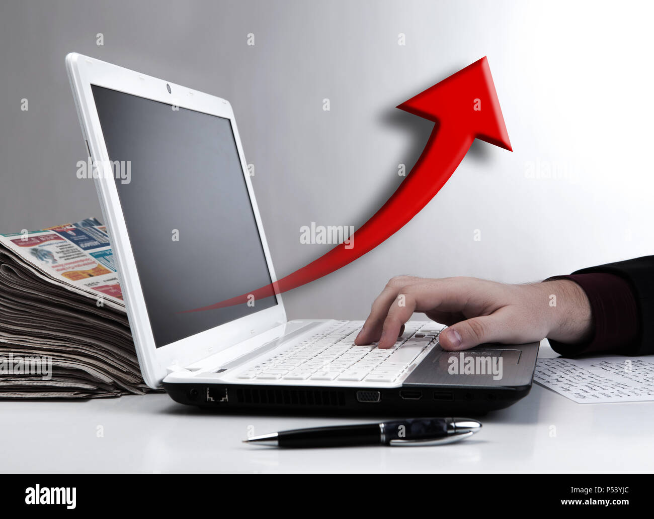human hand on the notebook keyboard and red arrow Stock Photo - Alamy