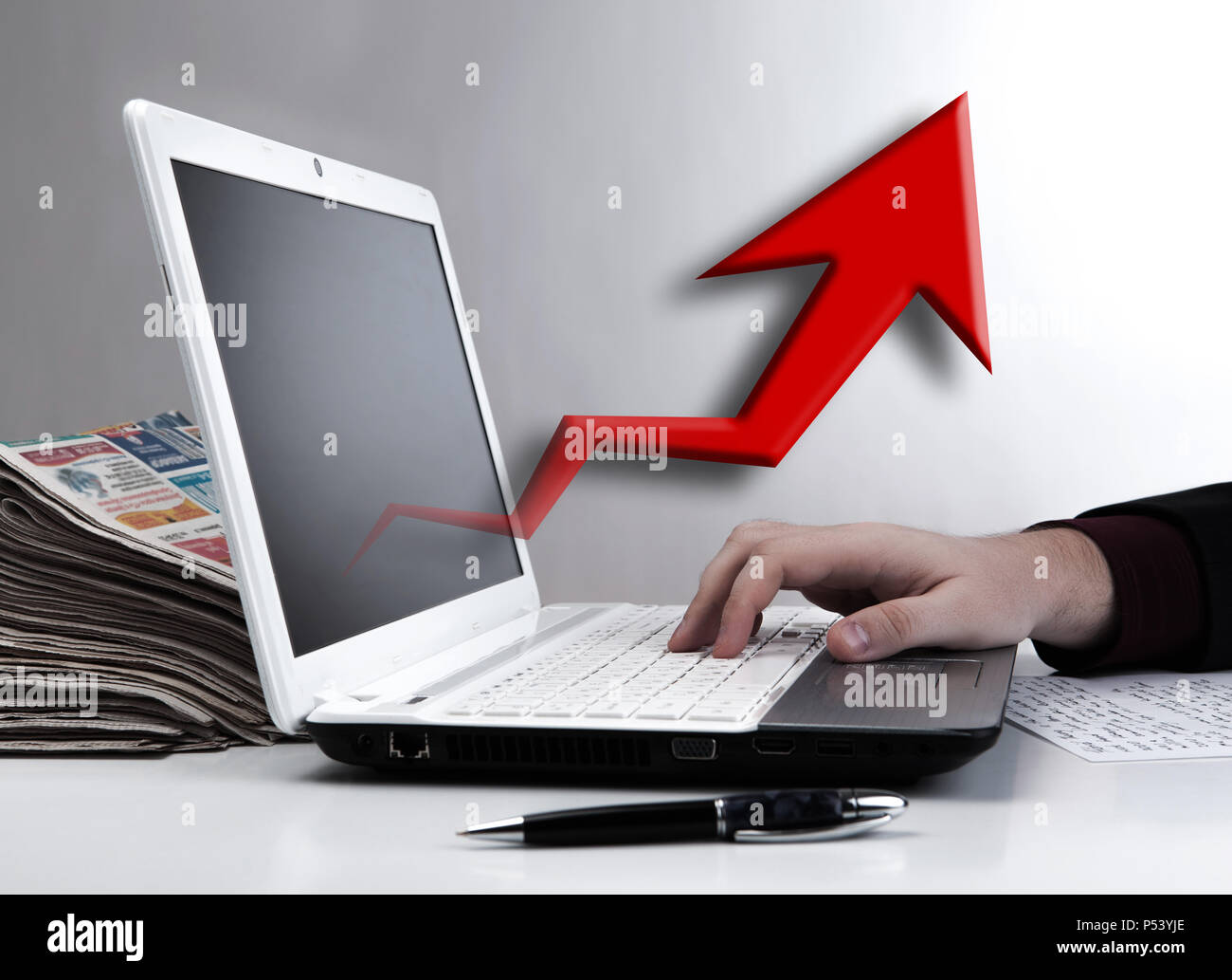human hand on the notebook keyboard and red arrow Stock Photo - Alamy