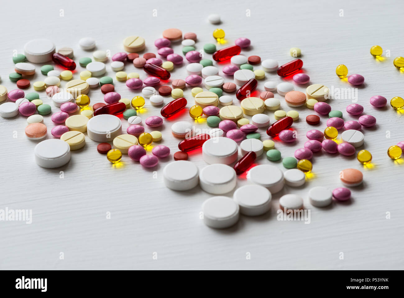Many colorful medicines. Pills and capsules on white background Stock ...