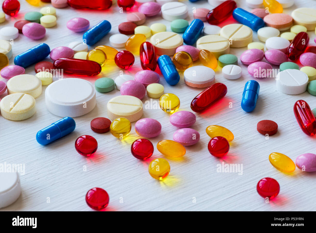 Many colorful medicines. Pills and capsules on white background Stock ...
