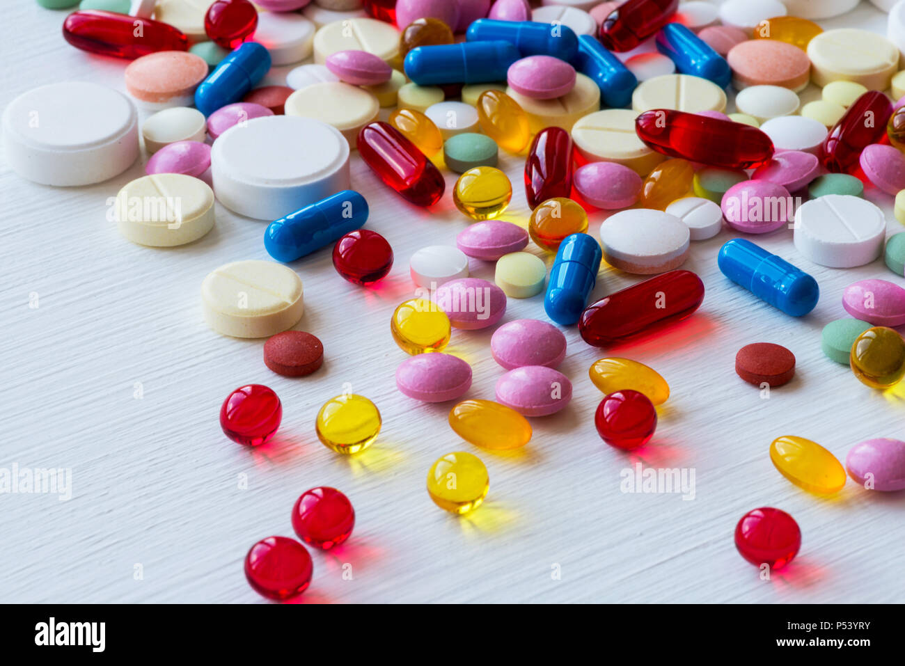 Many colorful medicines. Pills and capsules on white background Stock ...