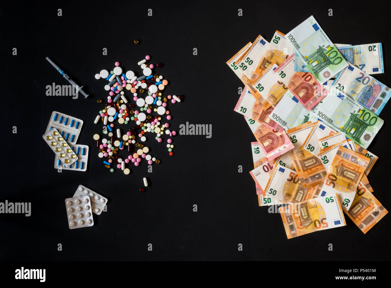 Money and pills. Pills of different colors on black background Stock ...