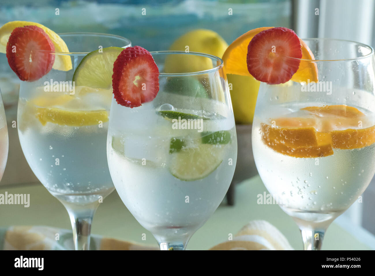 Refresh your thirst in style-sparkling water garnished with fresh fruit ...