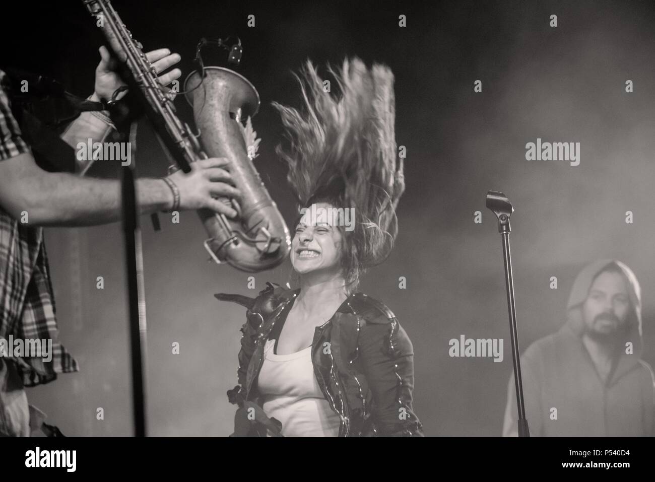 Singer (Echo) with standing hair on stage next to a saxophone while ...