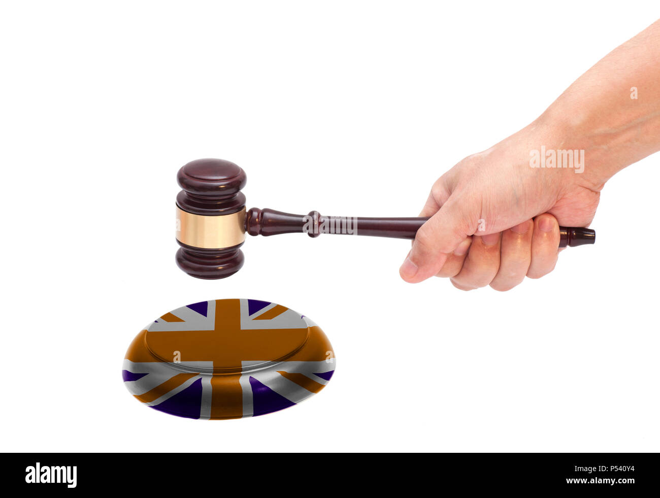 Hand knocking a Judge gavel at soundboard with British flag Isolated on ...