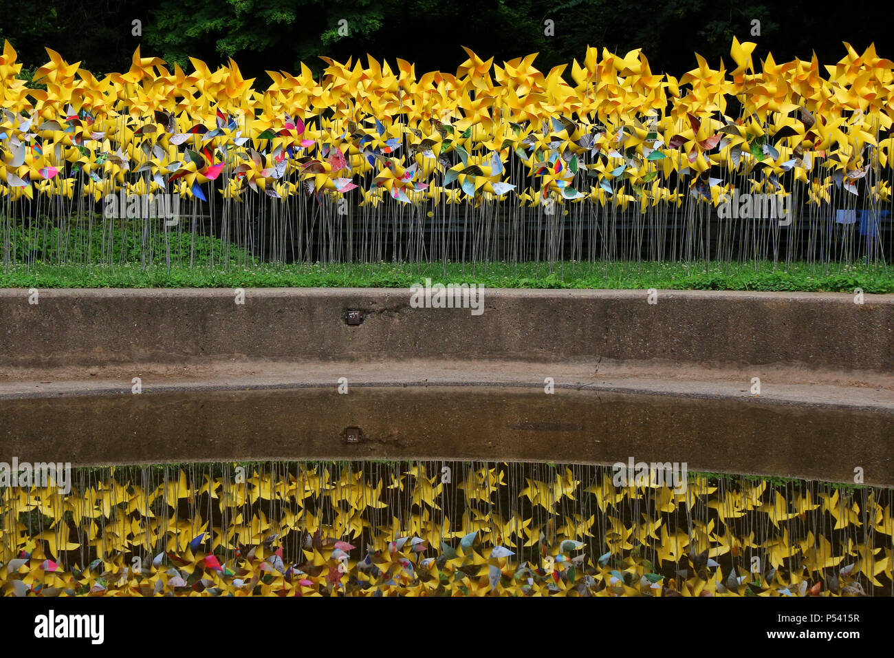 NEW YORK, NY - JULY 10: Yellow pinwheels placed in Prospect Park's Rose ...