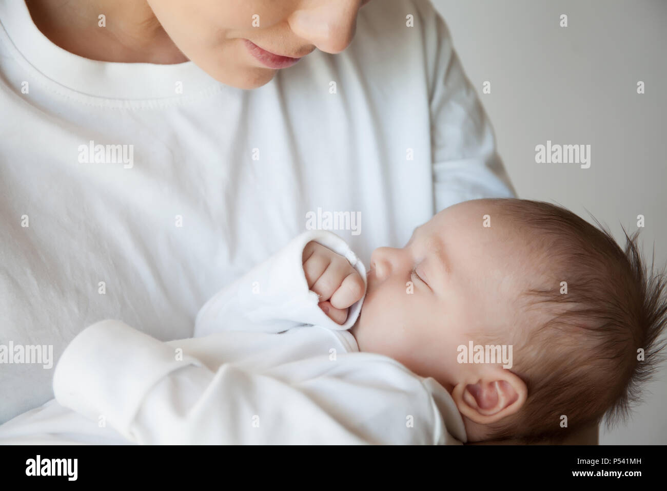 mother holds her new born baby in her hands Stock Photo - Alamy