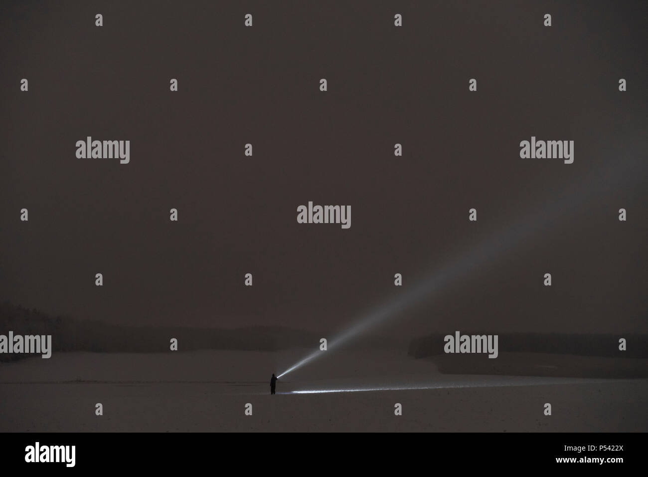 Human shining with flashlight at night in Sweden Scandinavia Europe ...