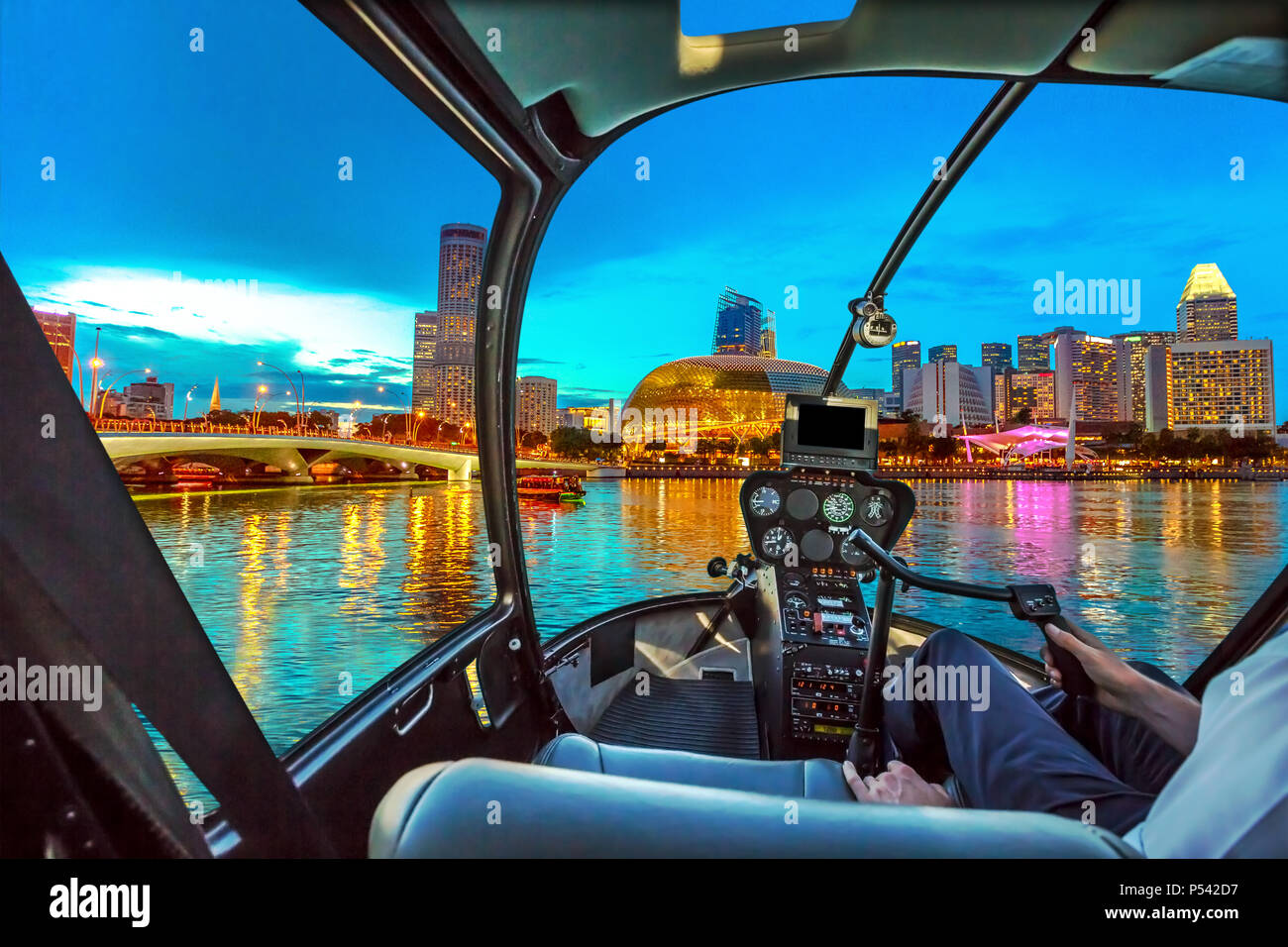 Helicopter cockpit interior flying on Skyline of Singapore in marina ...
