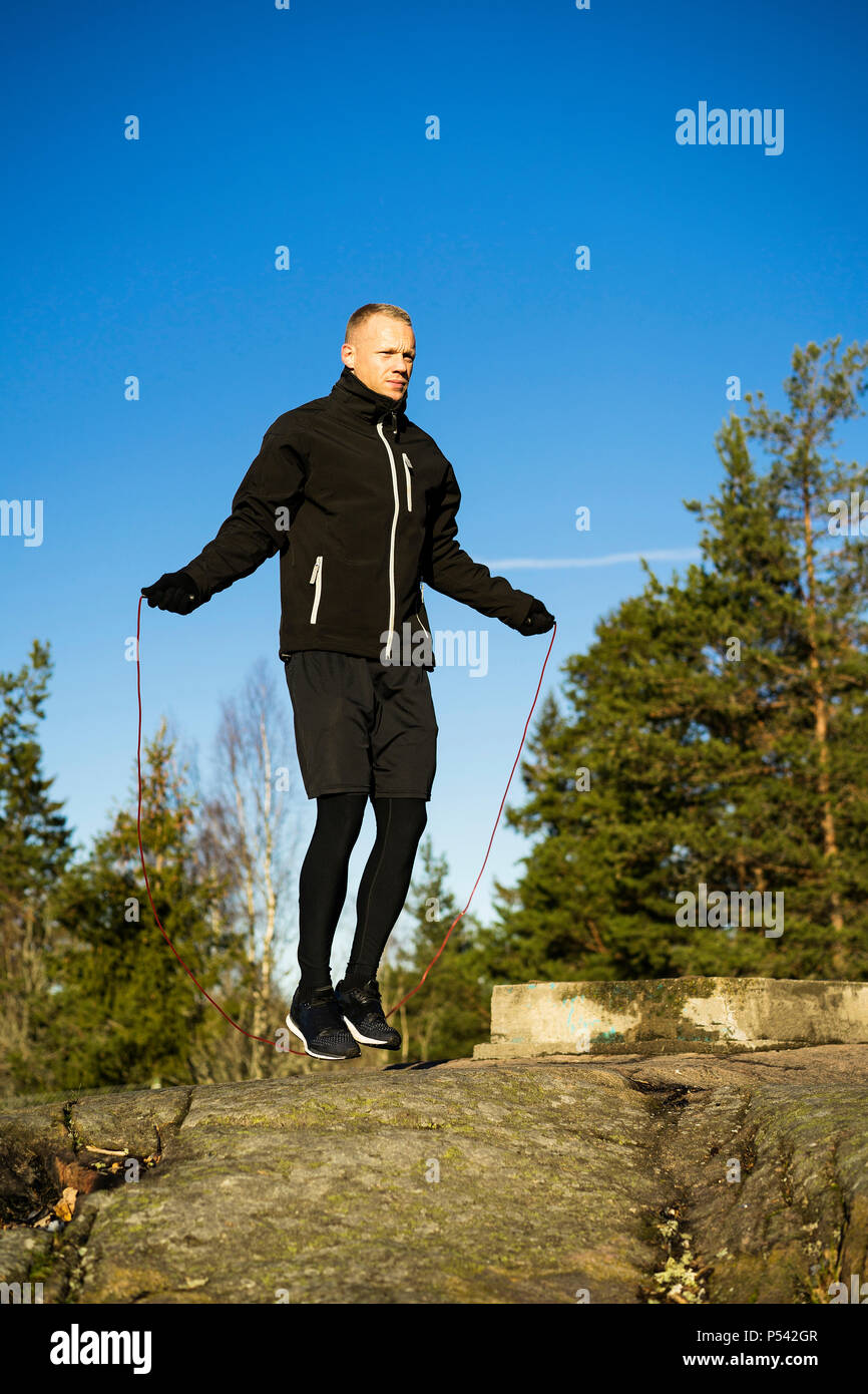 Male caucasian middle age boxer training outside in nature. Nice sunny ...