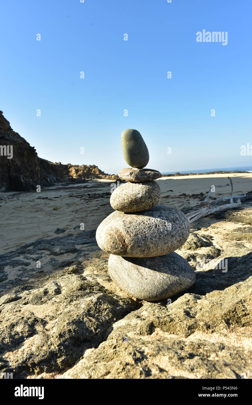 Zen rocks balanced stone stack on beach Stock Photo - Alamy