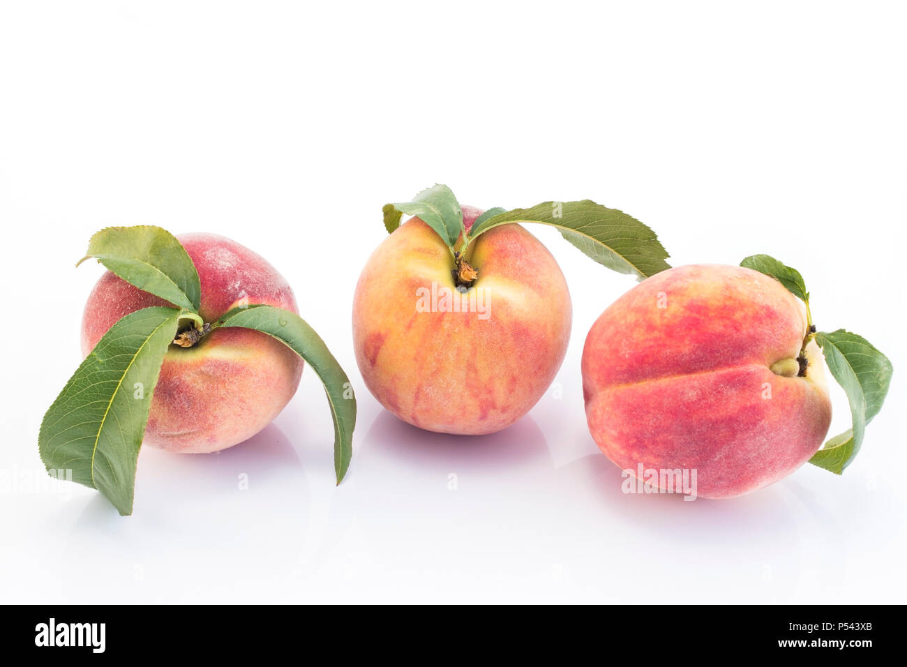 Three Peaches Isolated on White Background Stock Photo - Alamy