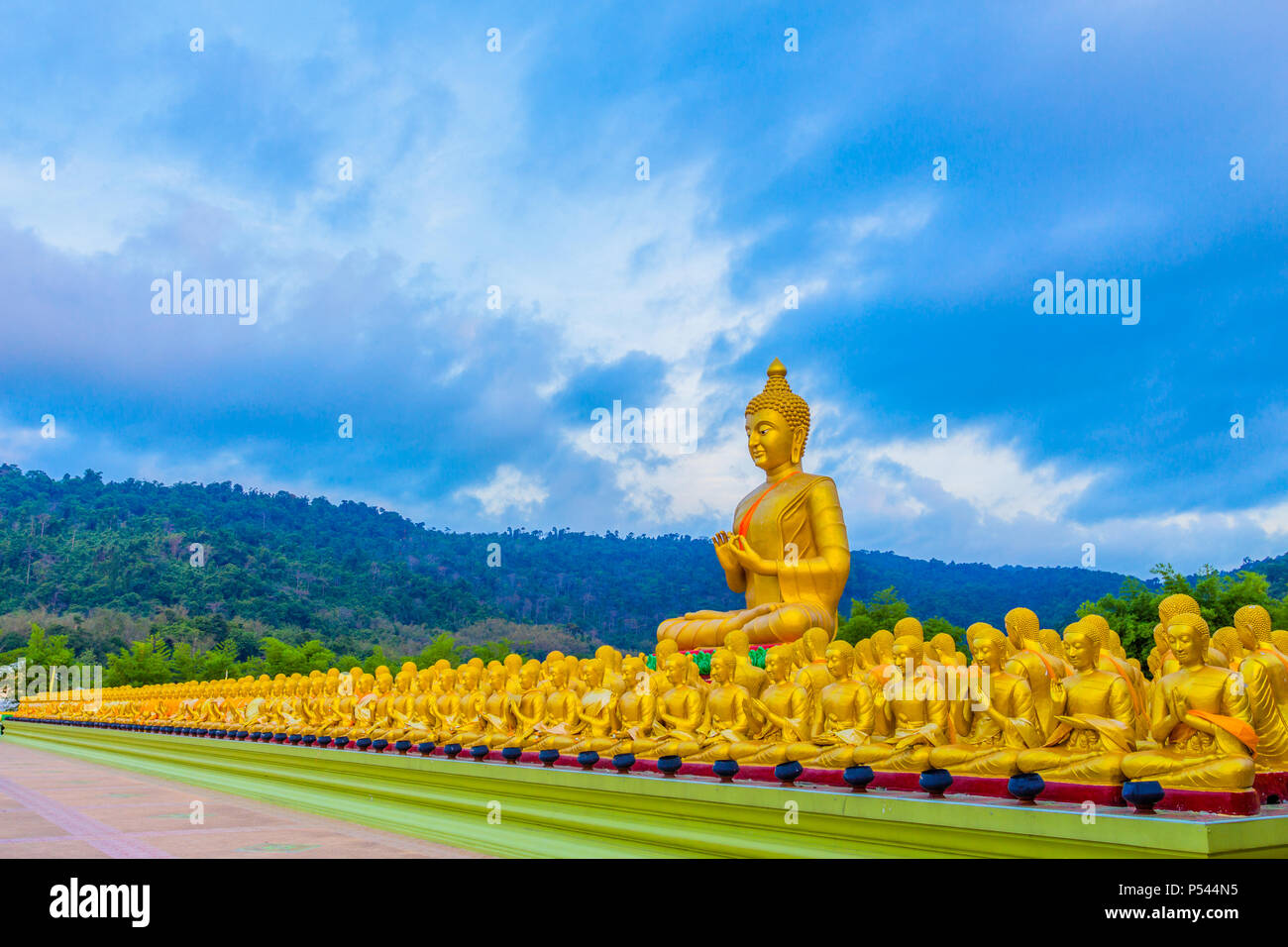 the golden big Buddha statue among a lot of small Buddha statues in ...