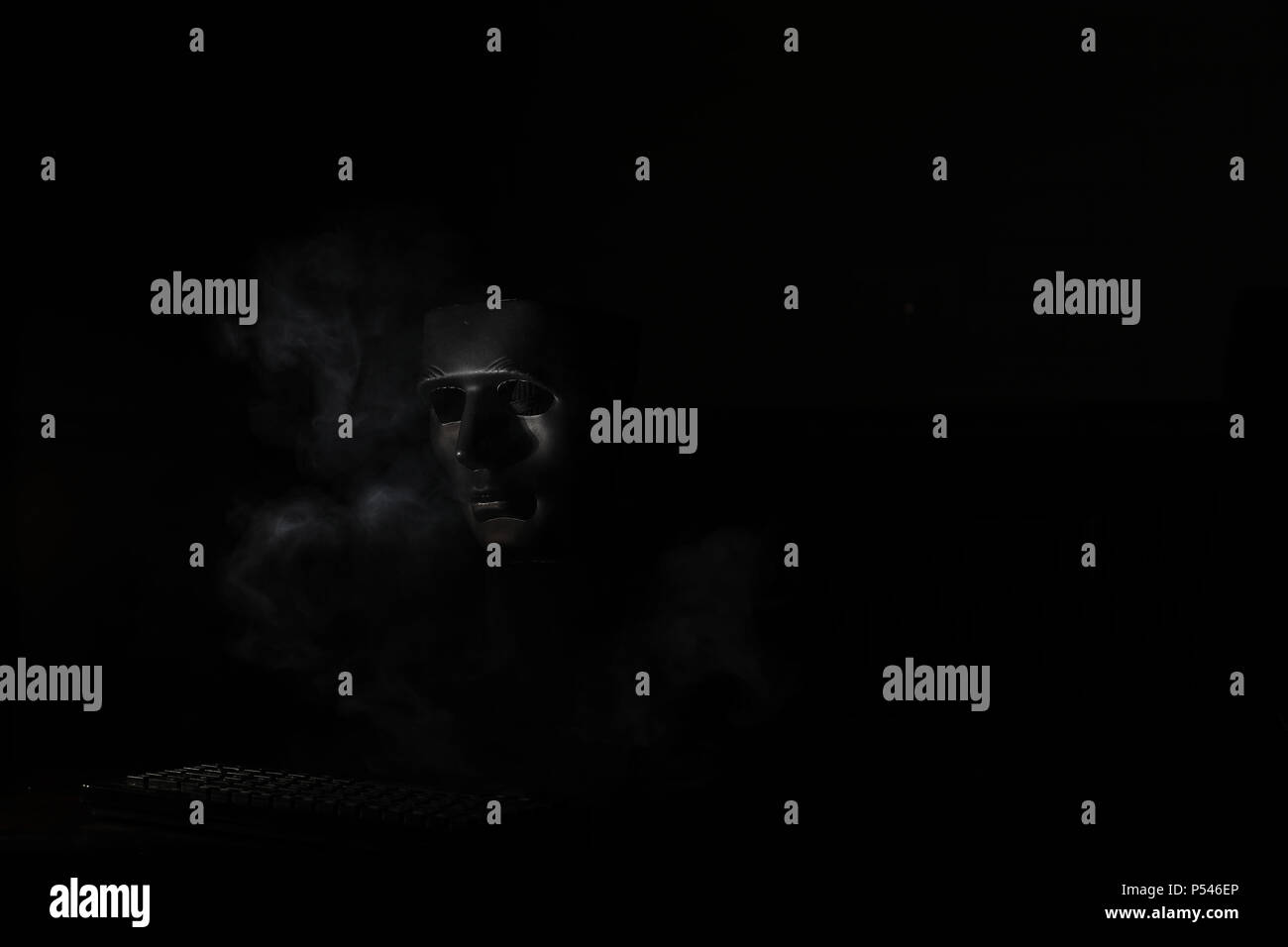 Black mask in the dark secretive ritual and mystery Stock Photo - Alamy