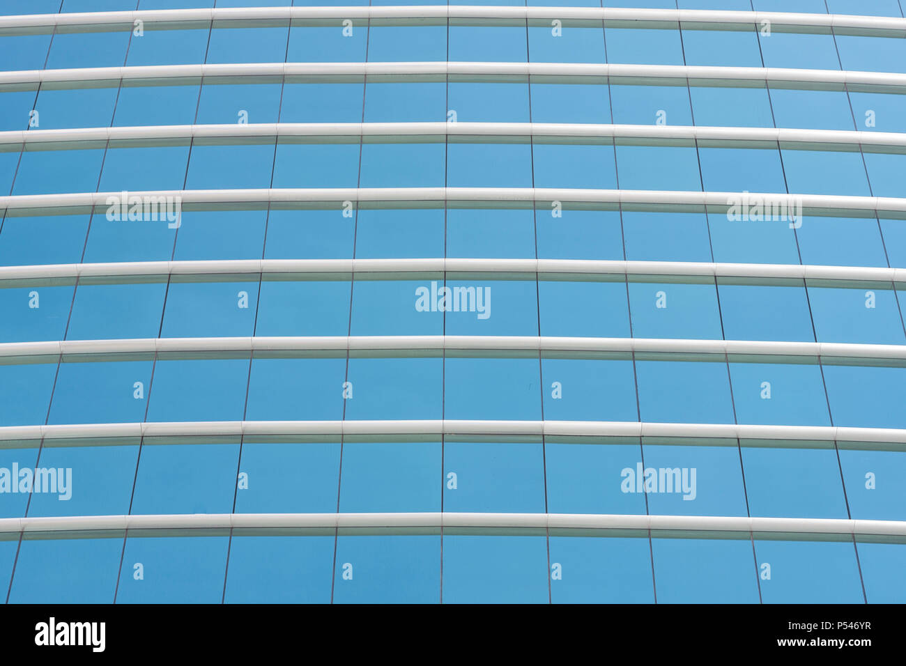 blue glass wall of office building with sky reflect Stock Photo - Alamy