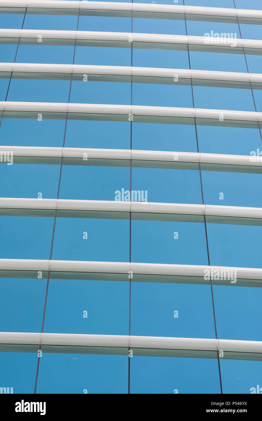 blue glass wall of office building with sky reflect Stock Photo - Alamy