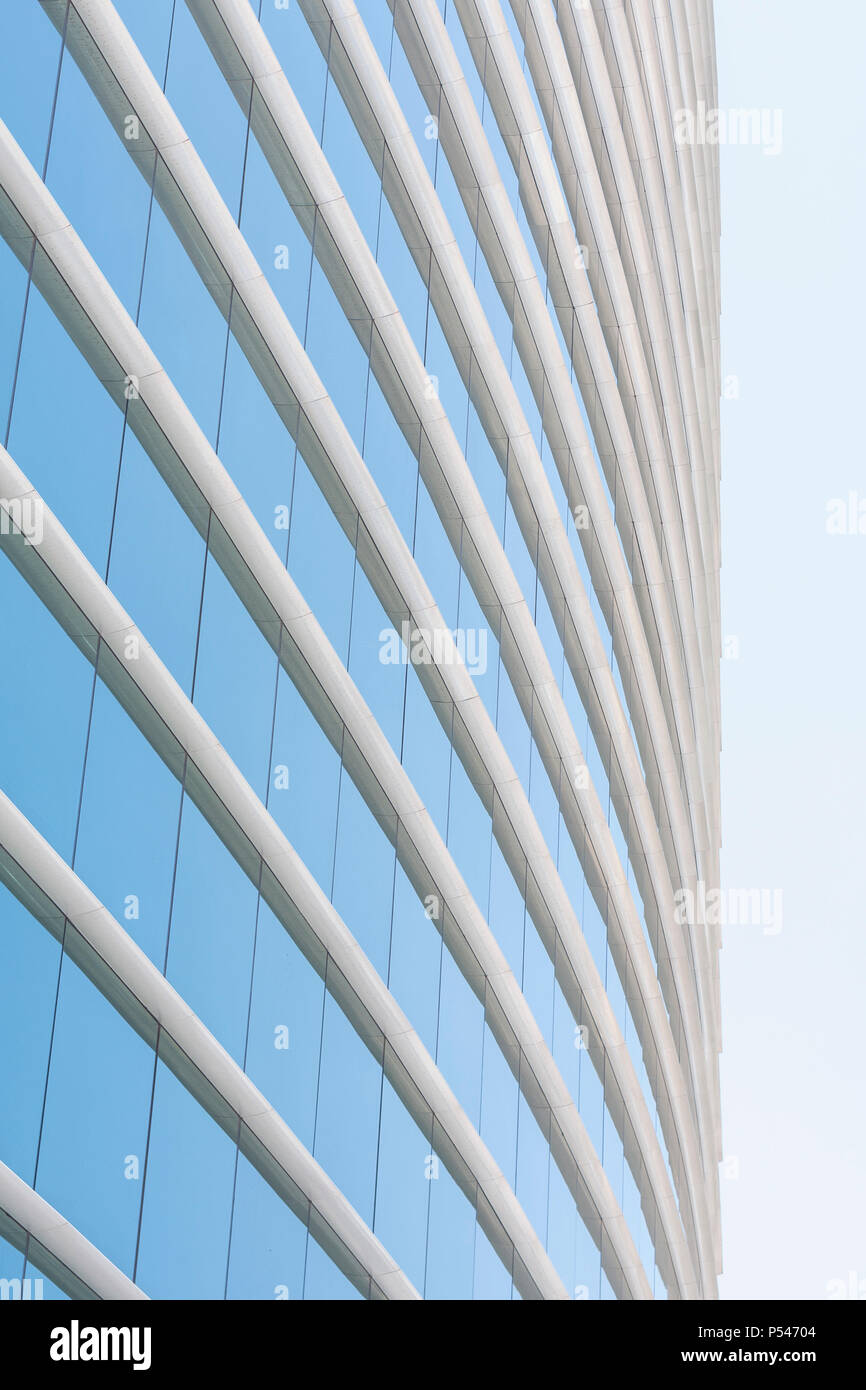 blue glass wall of office building with sky reflect Stock Photo - Alamy