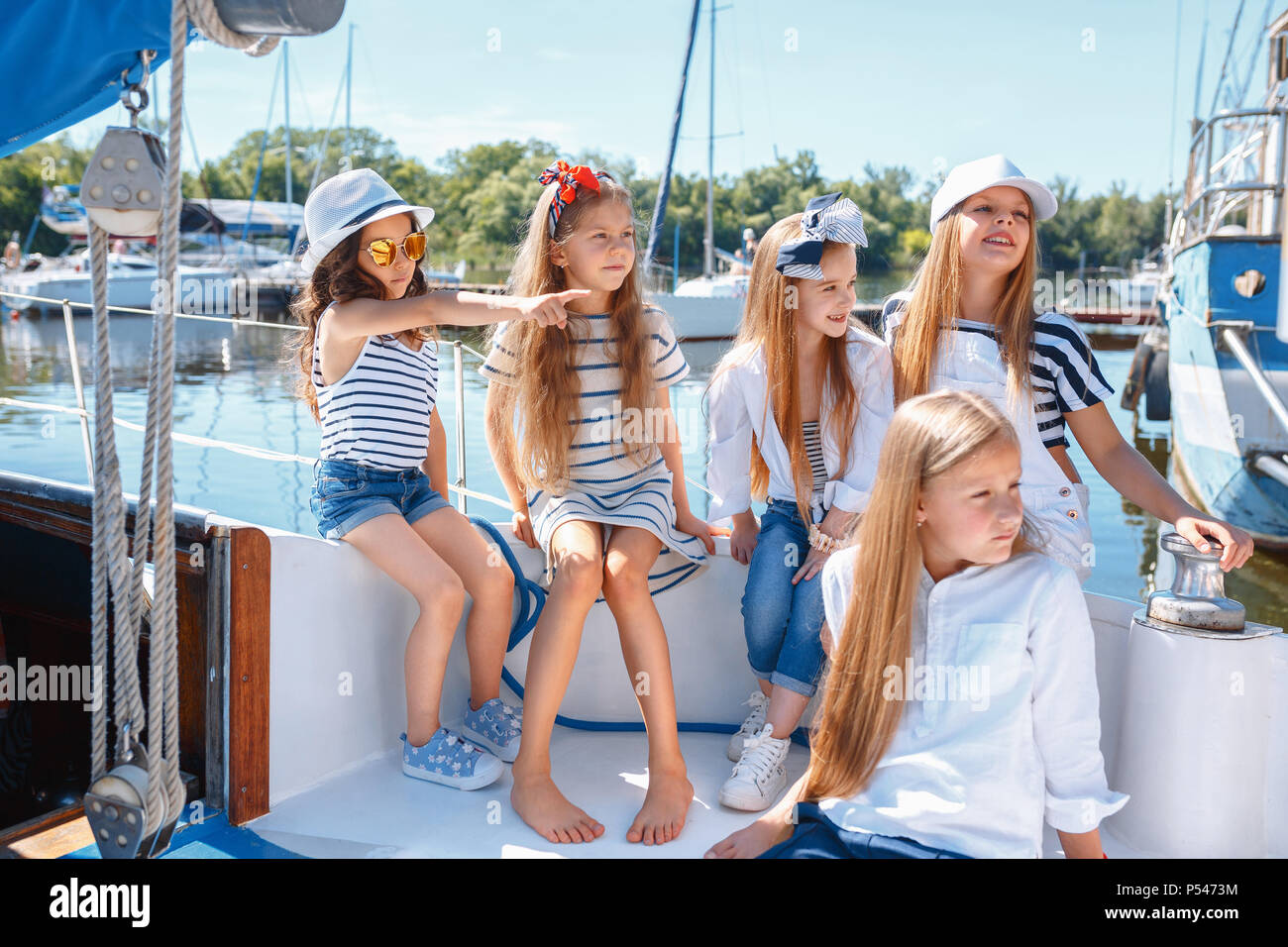 The children on board of sea yacht Stock Photo - Alamy