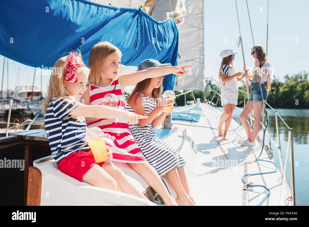 The children on board of sea yacht Stock Photo - Alamy