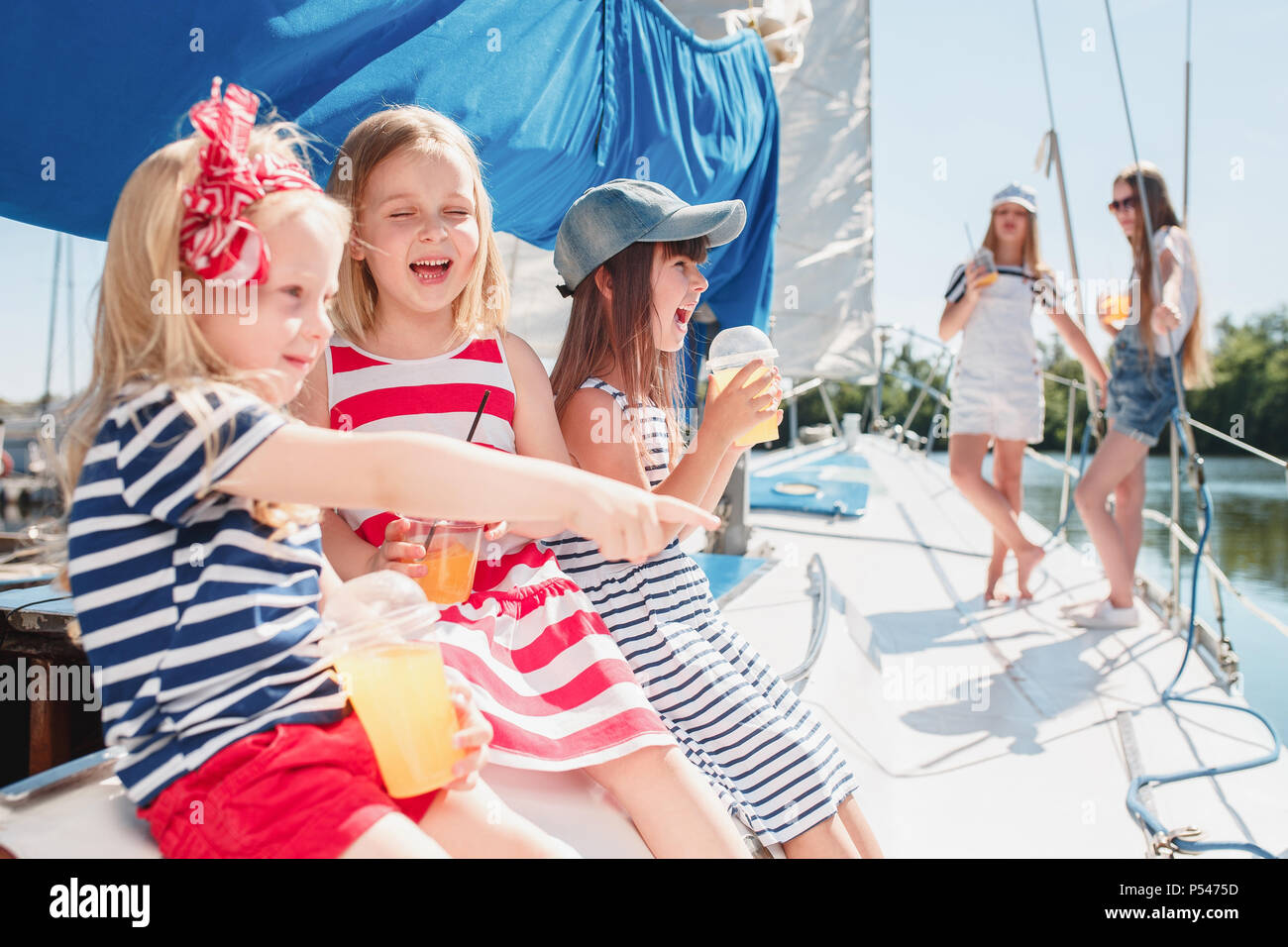 The children on board of sea yacht Stock Photo - Alamy