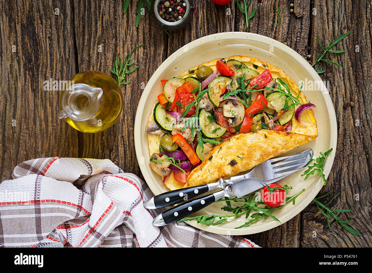Omelet with tomatoes, zucchini and mushrooms. Omelette breakfast ...