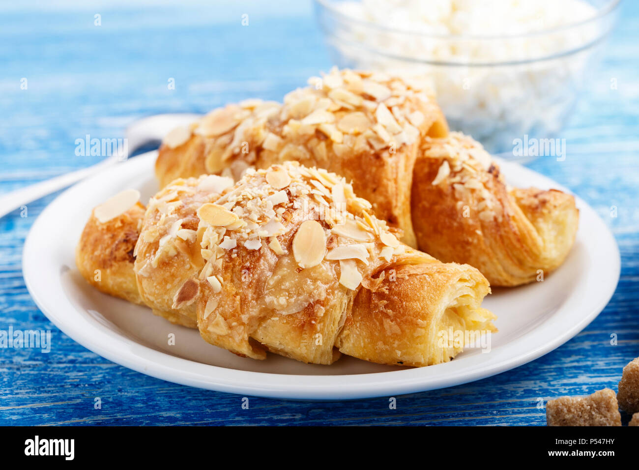 fresh bakery. croissants with almond flakes. traditional French ...
