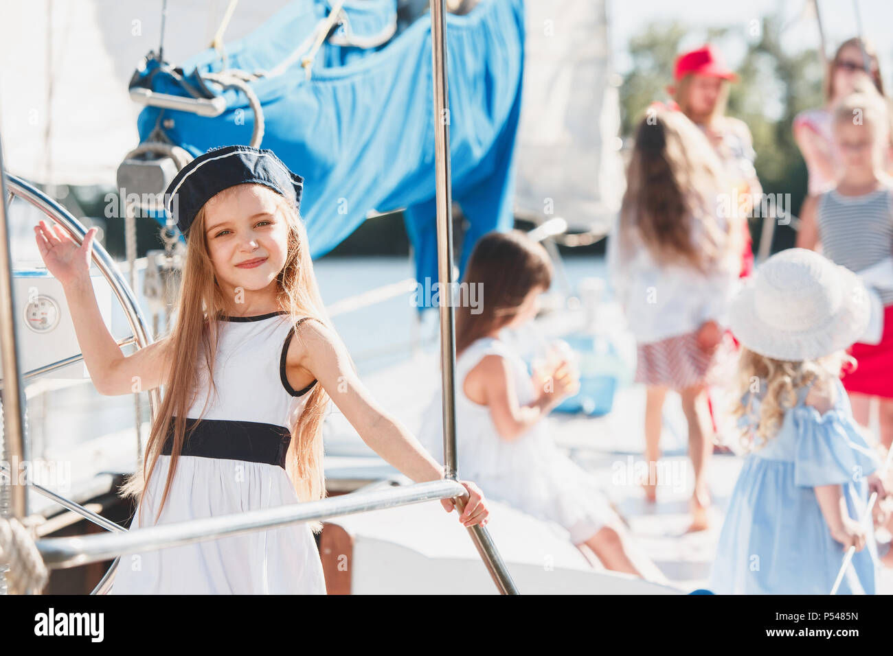 The children on board of sea yacht Stock Photo - Alamy