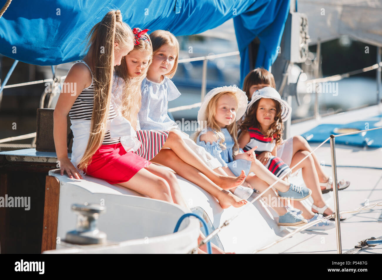 The children on board of sea yacht Stock Photo - Alamy