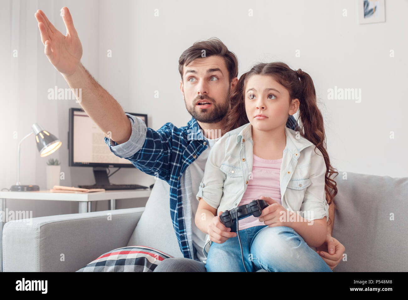 Bearded man and little girl at home family time daughter sitting on ...