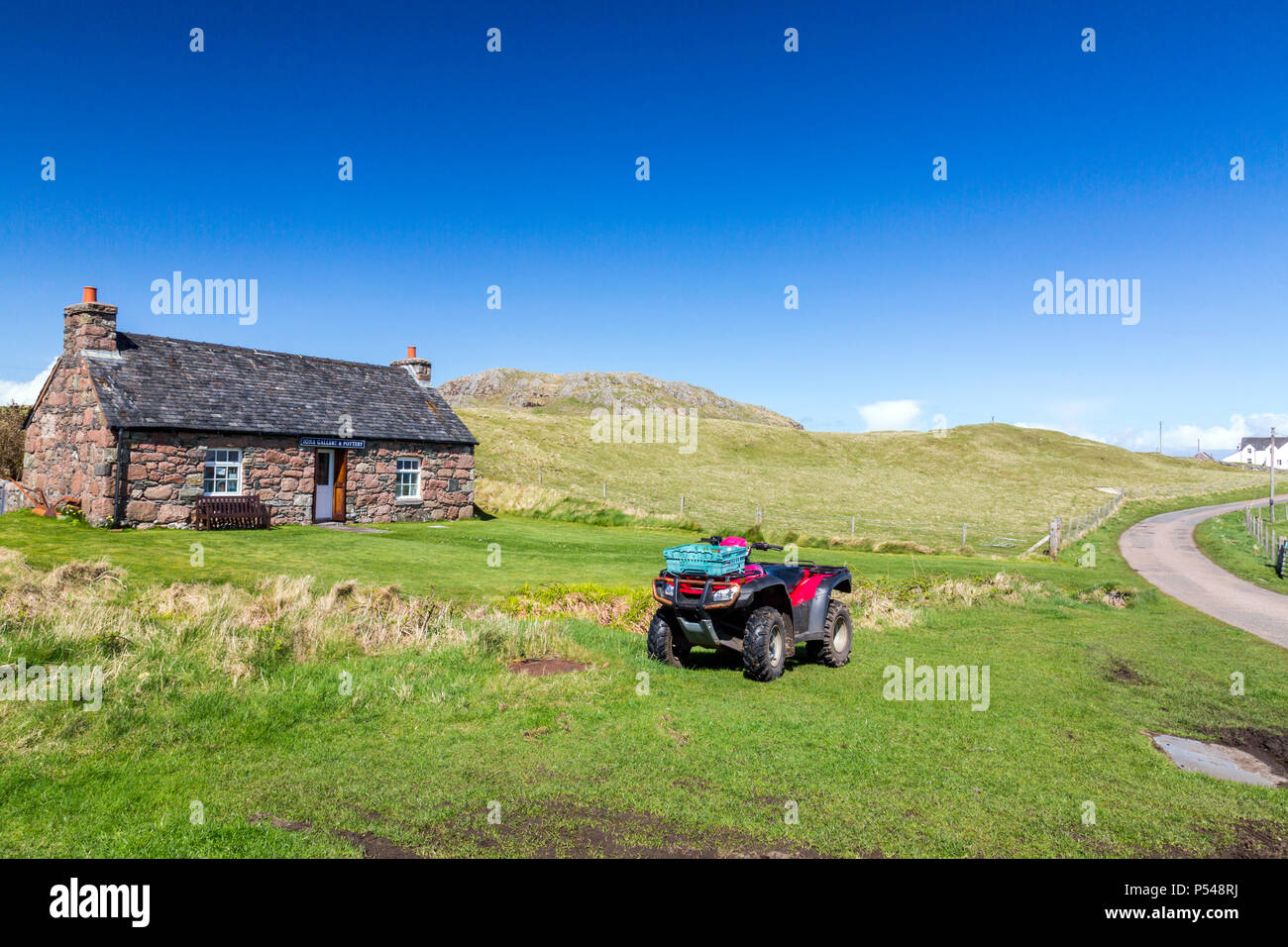 A quad bike outside a cottage built from granite stones, now the Iona ...