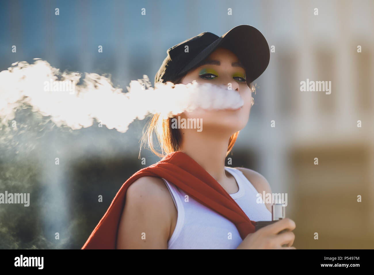 Pretty young asian girl vape popular ecig gadget,vaping device.Happy ...