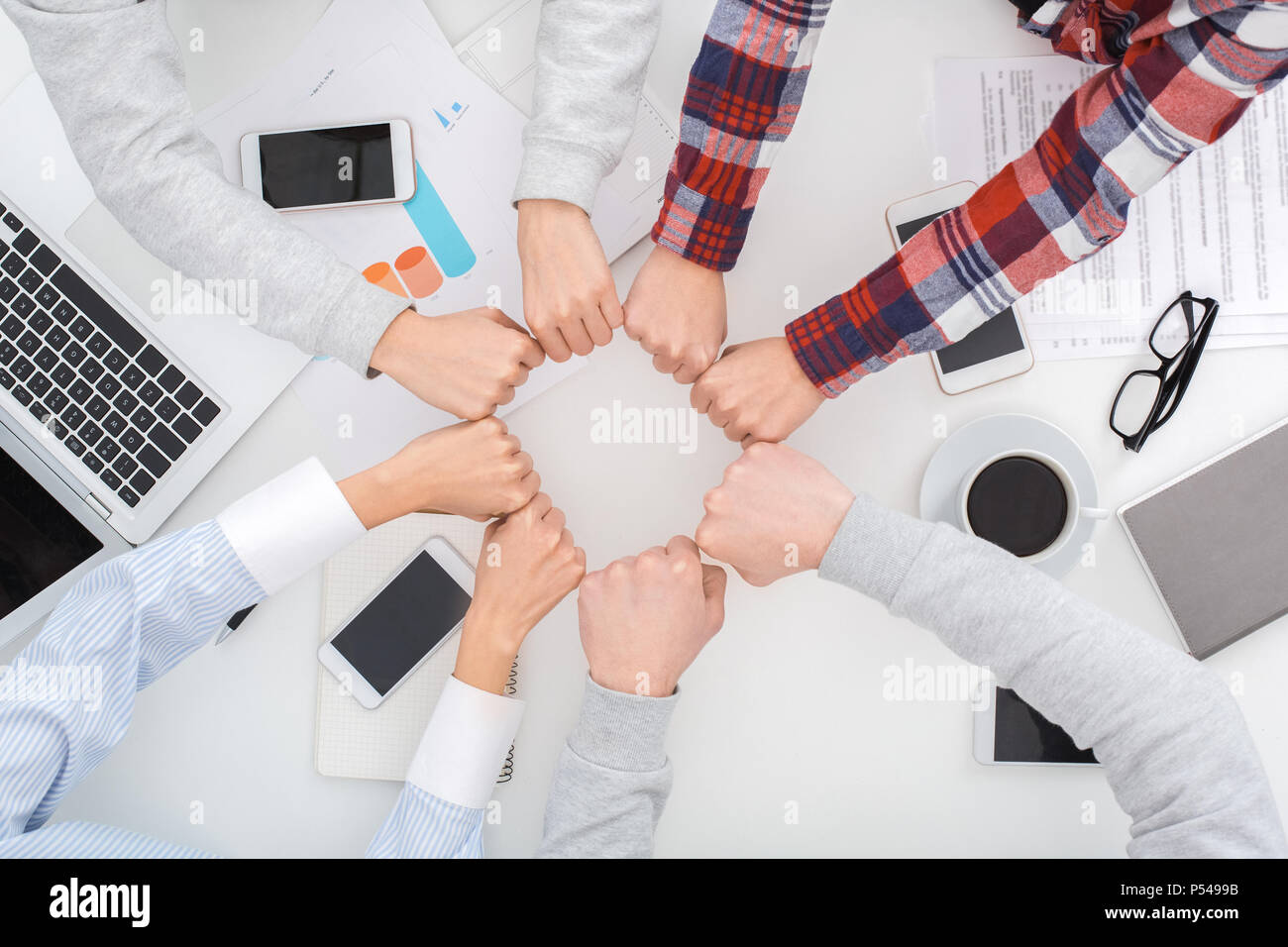 Group of men and women work together top view close-up team spirit ...