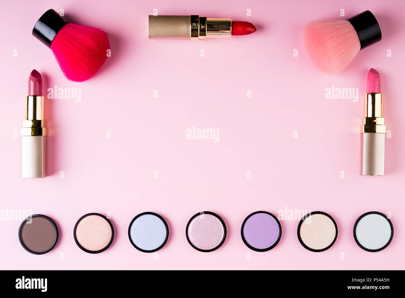 Frame of makeup products and decorative cosmetics on pink background ...