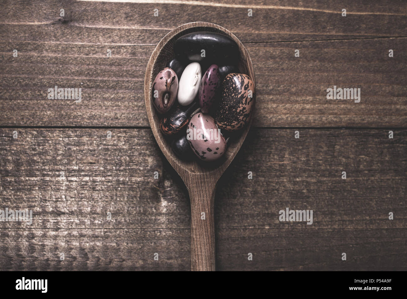 Organic Colorful Beans and Wooden Spoon on Dark Background Stock Photo ...