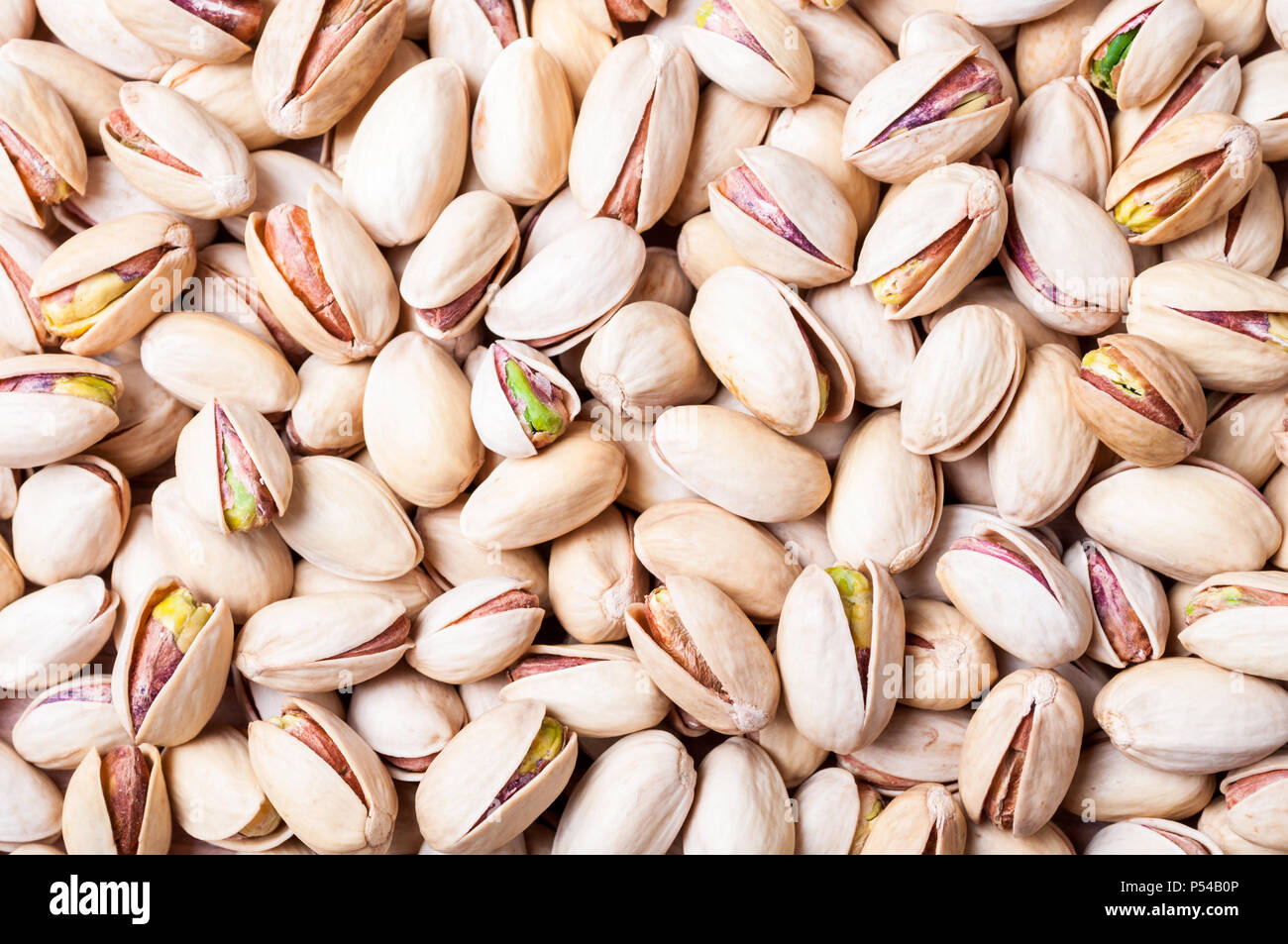 Pistachios background. Pistachio texture. Nuts. Top view Stock Photo ...