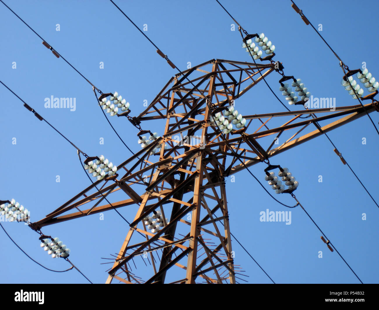 an image of a metal tower of Power Lines Stock Photo - Alamy
