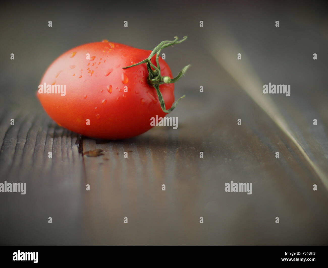 First tomato of my plant Stock Photo - Alamy
