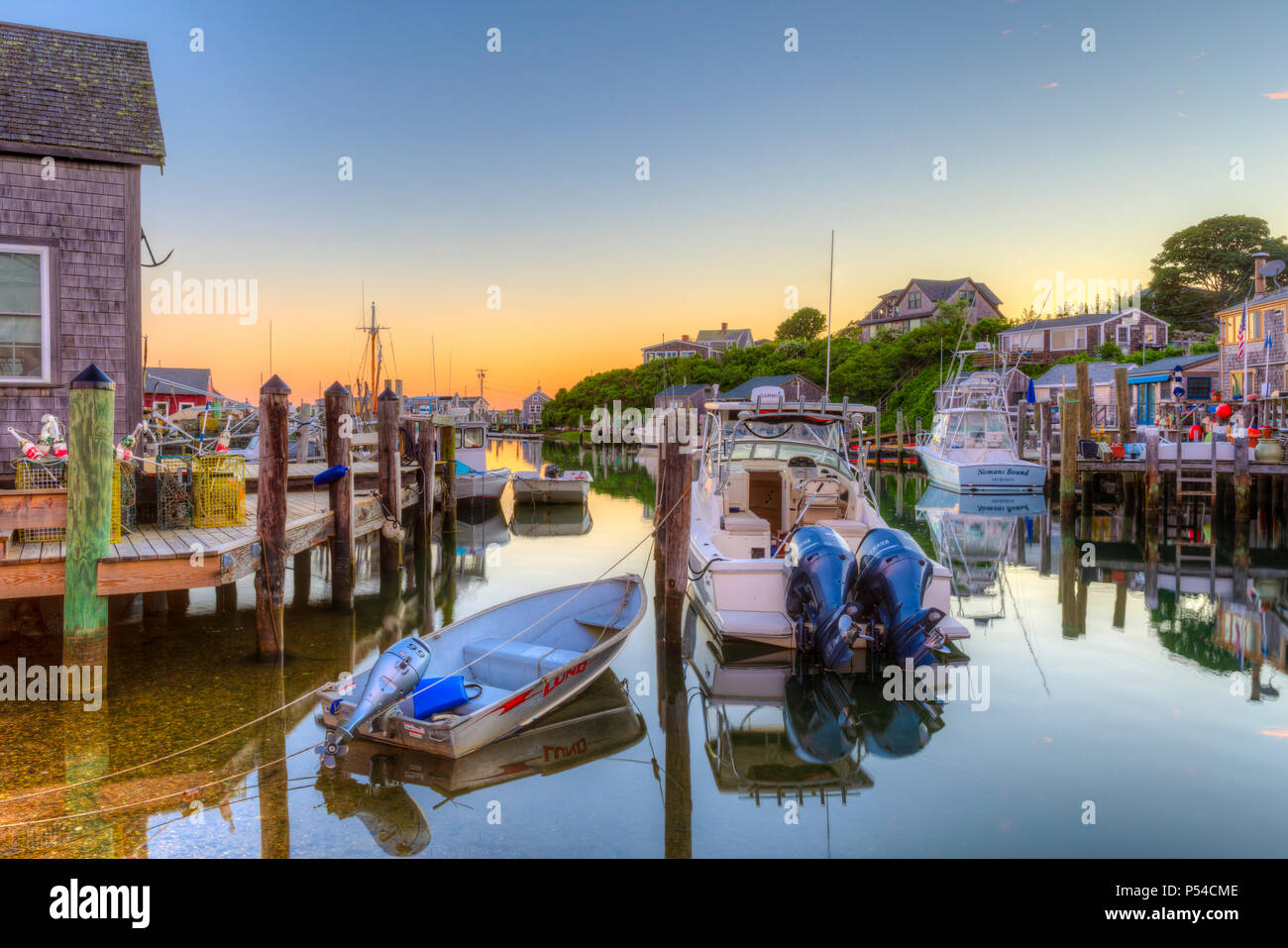 The commercial fishing village of Menemsha under a colorful sky during ...