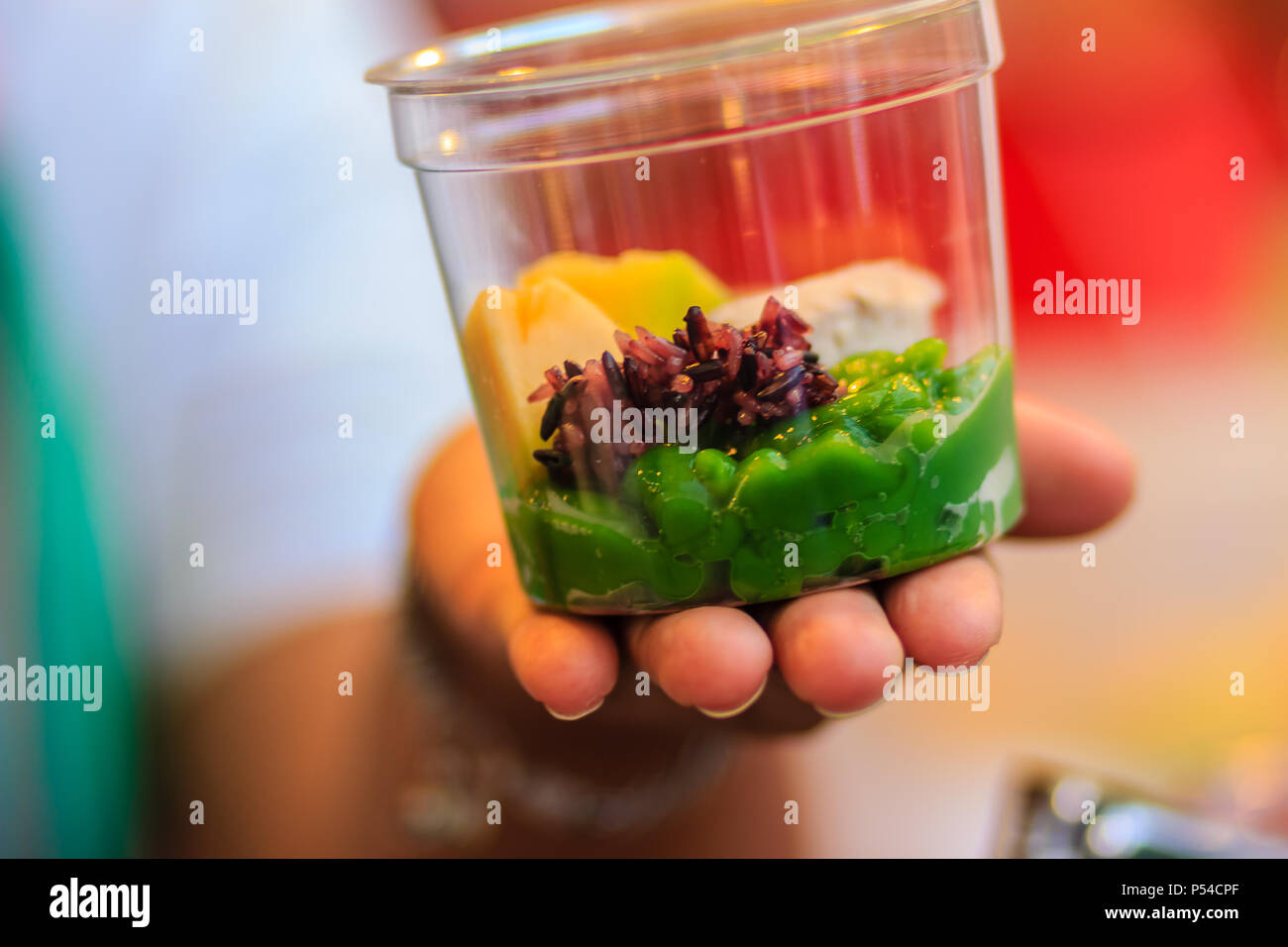 Close up Cendol vendor selling his new cendol formula at night market ...