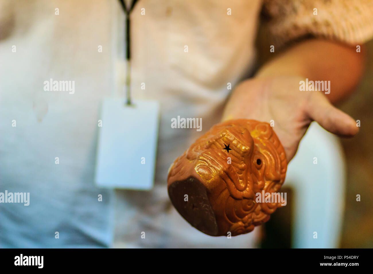 Close up hand of Thai sculptor during painting the masterpiece of ...