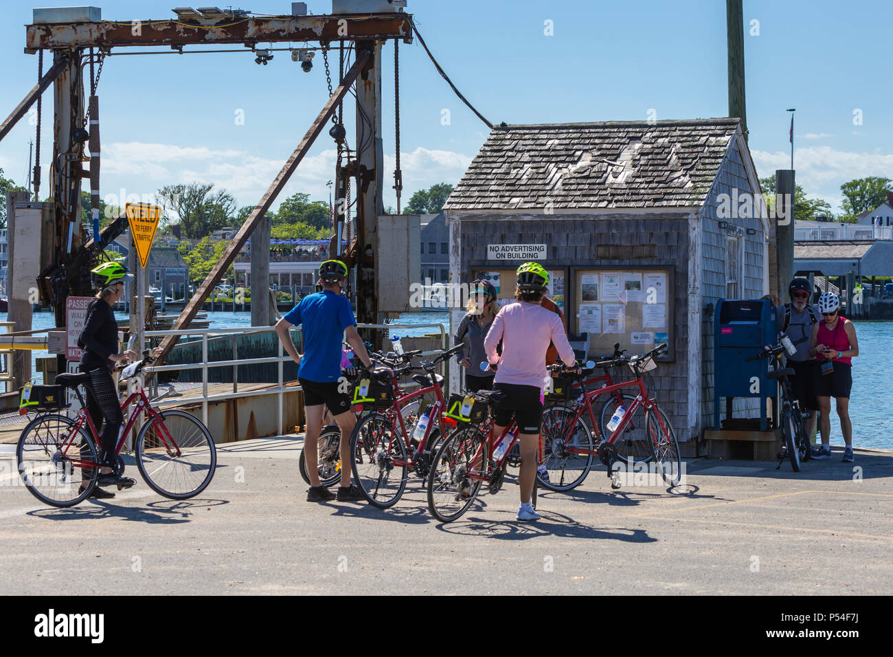 Cyclists wait on Chappaquiddick Island to take the Chappy Ferry across ...