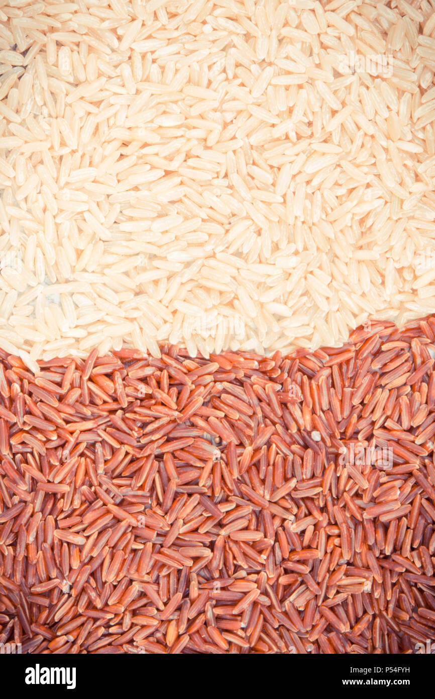 Vintage photo, Brown and red rice as background, concept of healthy ...