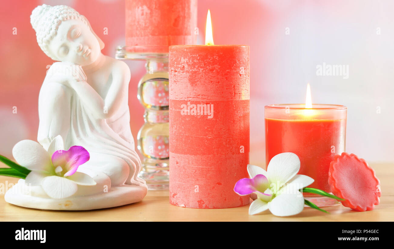 Zen style aromatherapy spa table setting with buddha, flowers and ...