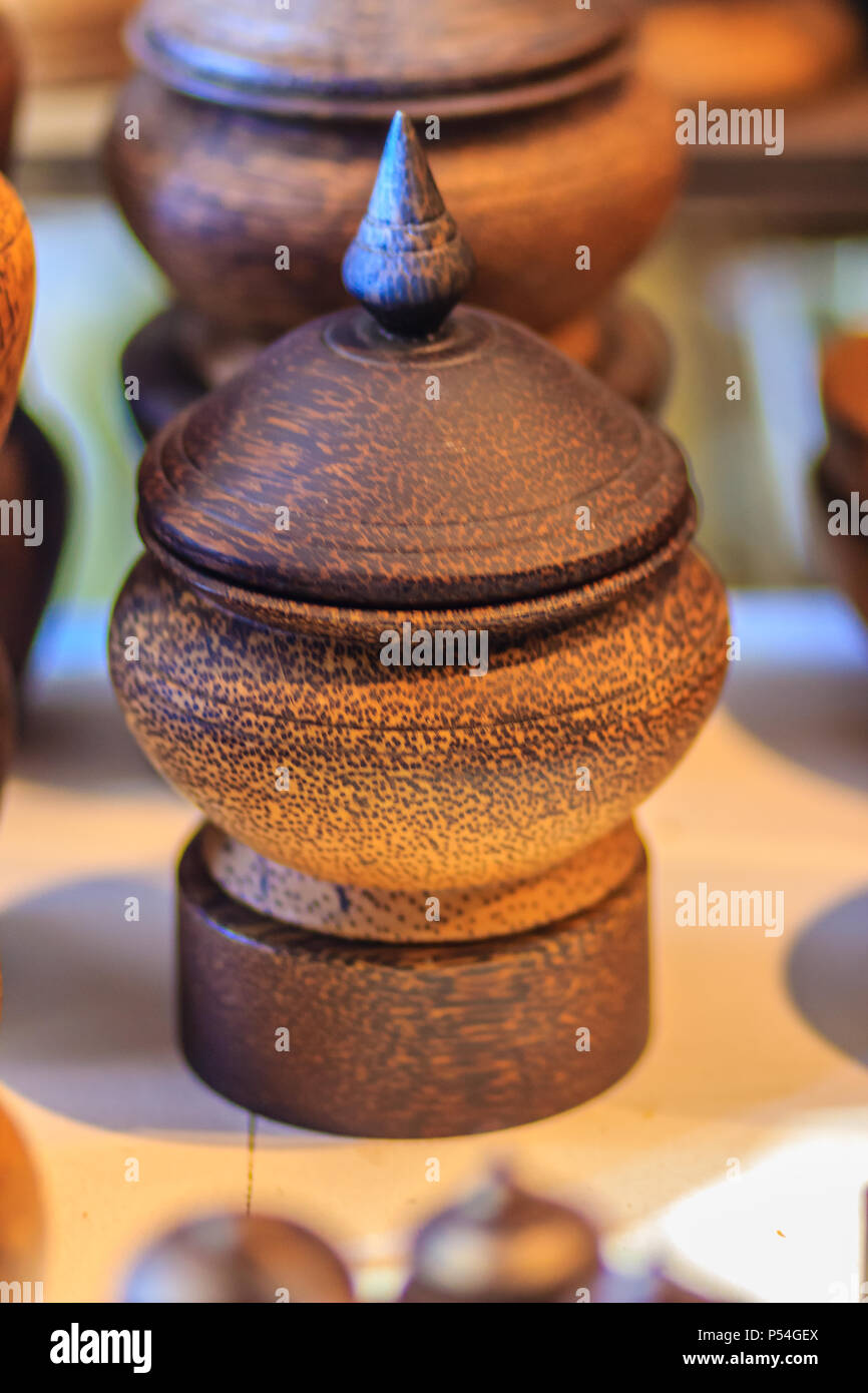 Beautiful Thai style Pot made from coconut wood Stock Photo - Alamy