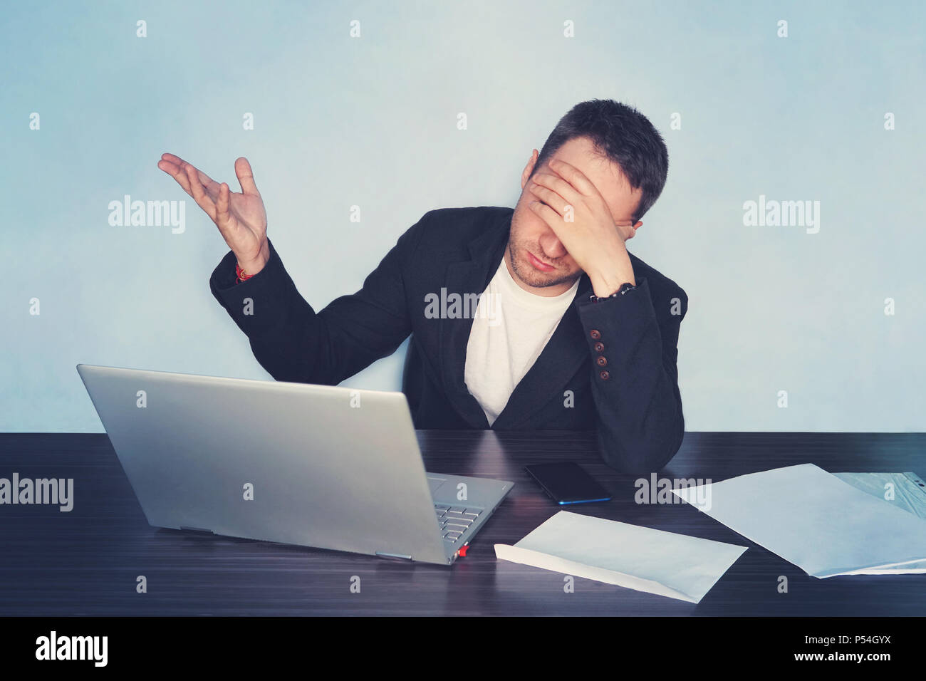 bankruptcy of the enterprise. Business man working at a computer in the ...