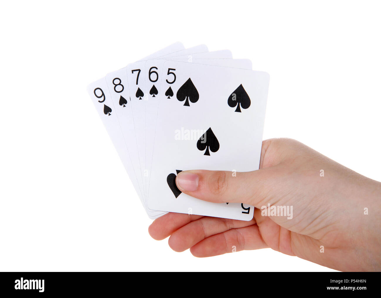 Young female hand holding Playing cards, a straight flush. A straight ...