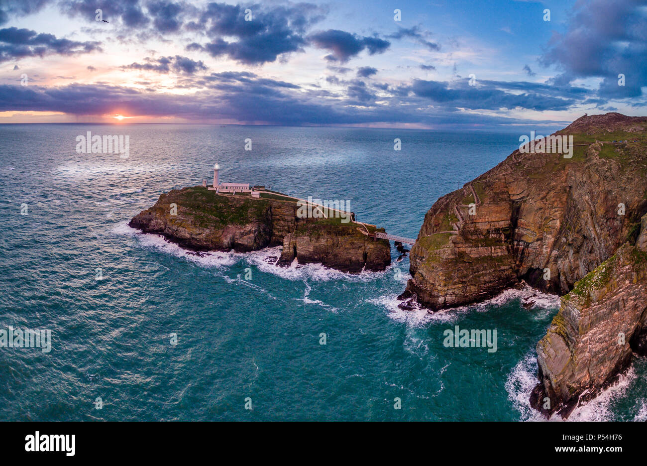 Aerial view of South Stack with lighthouse during sunset Stock Photo ...