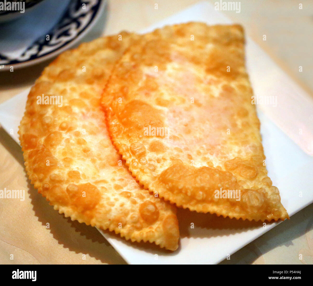 Photo of macrobanche with cheese and greens in restaurant. Folk dish ...