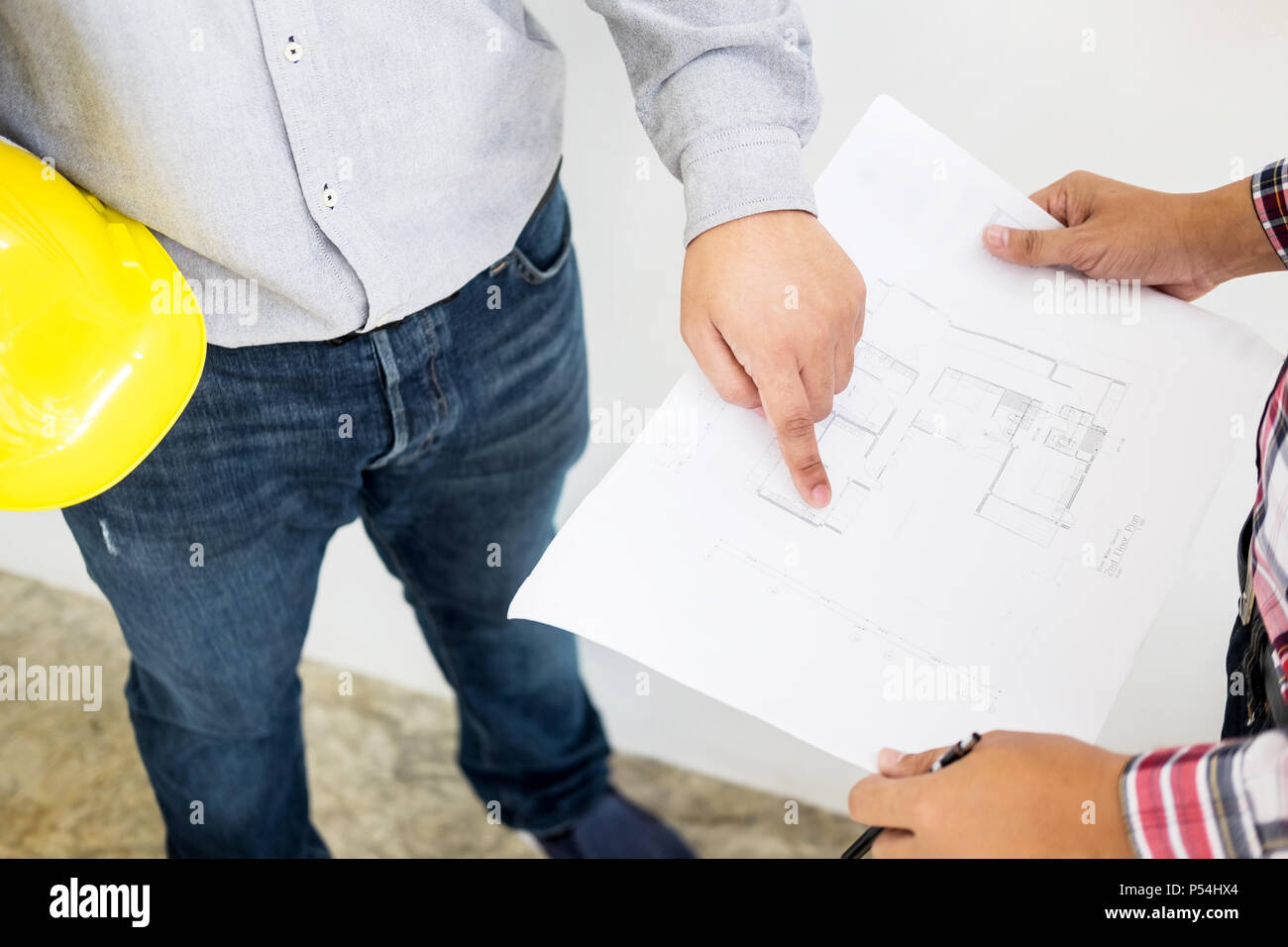 Close-up Of Person's engineer Hand Drawing Plan On Blue Print with ...